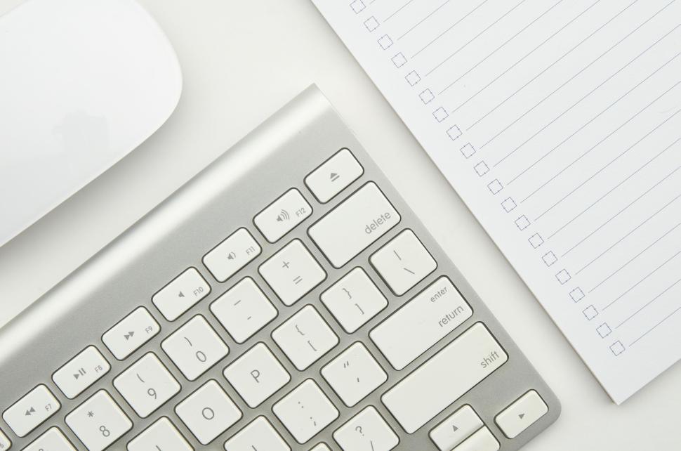 Free Stock Photo of Silver keyboard and notepad with checkbox lines on ...