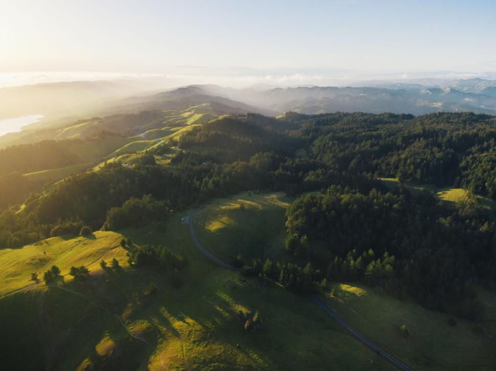 Free Stock Photo of Aerial view of expansive green hills during sunrise ...