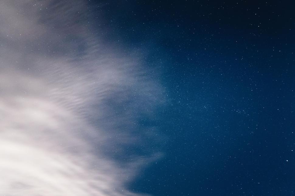 Free Stock Photo of Starry night sky blending with wispy clouds in ...