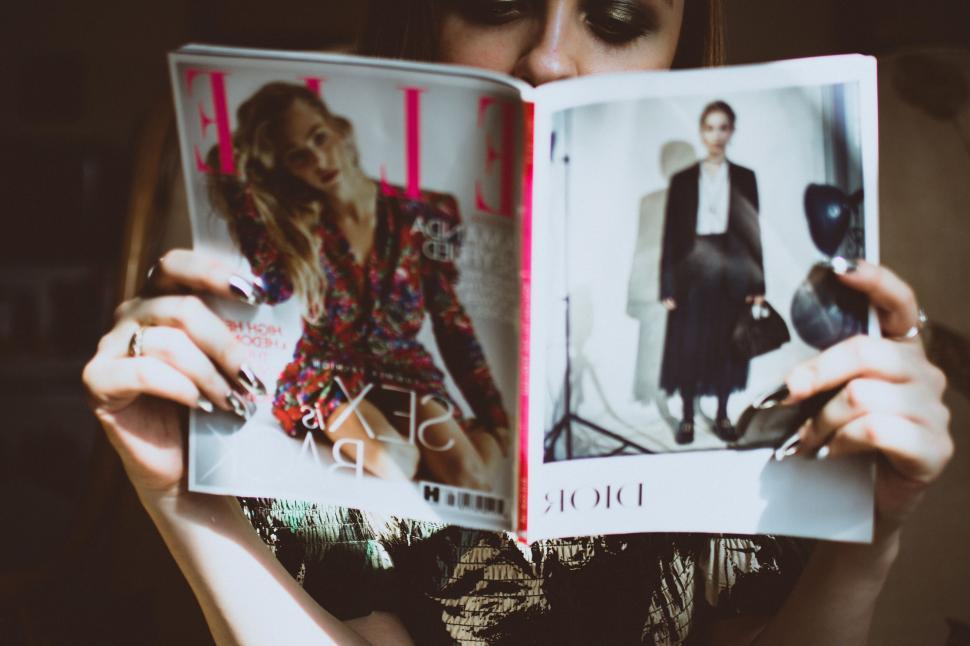 Free Stock Photo of Person reading a magazine with fashion content and ...