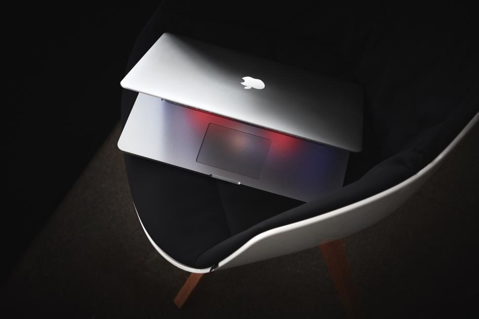 Free Stock Photo of Closed laptop with a glowing Apple logo on a modern ...