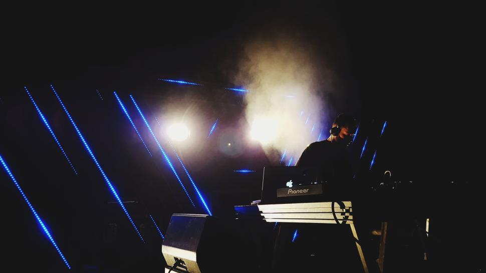 Free Stock Photo of DJ performing at night amidst bright lights and ...