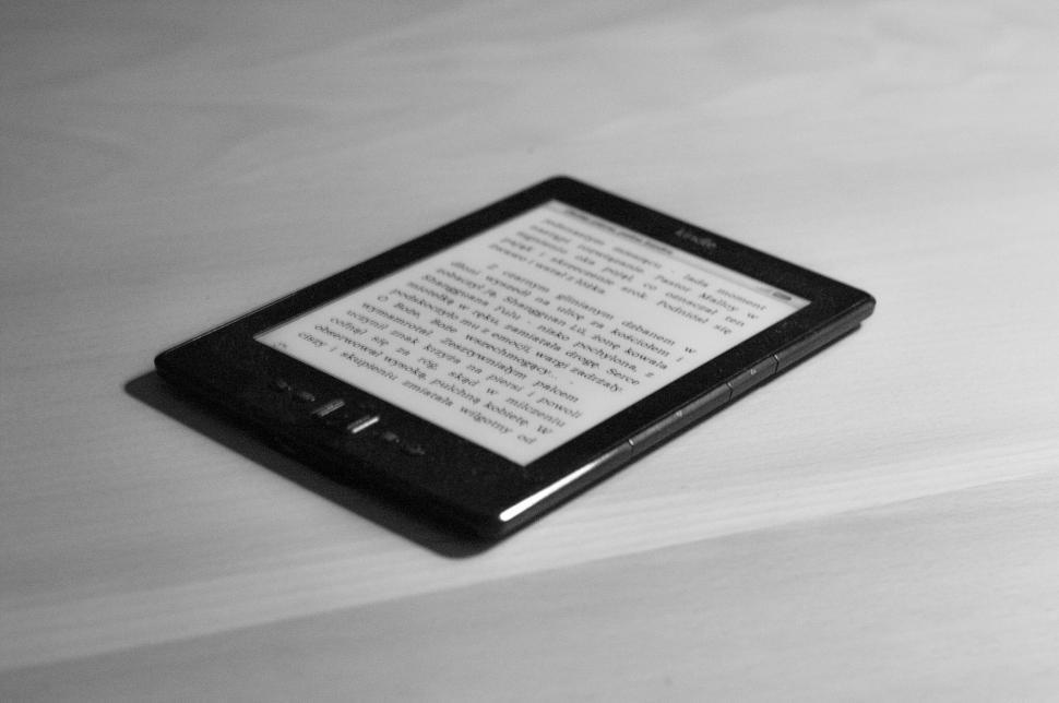 Free Stock Photo of Black e-reader with text on a wooden surface ...