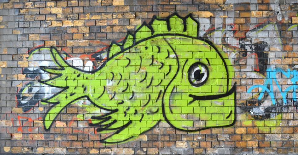 Free Stock Photo of Graffiti of a cheerful green fish on a brick wall ...