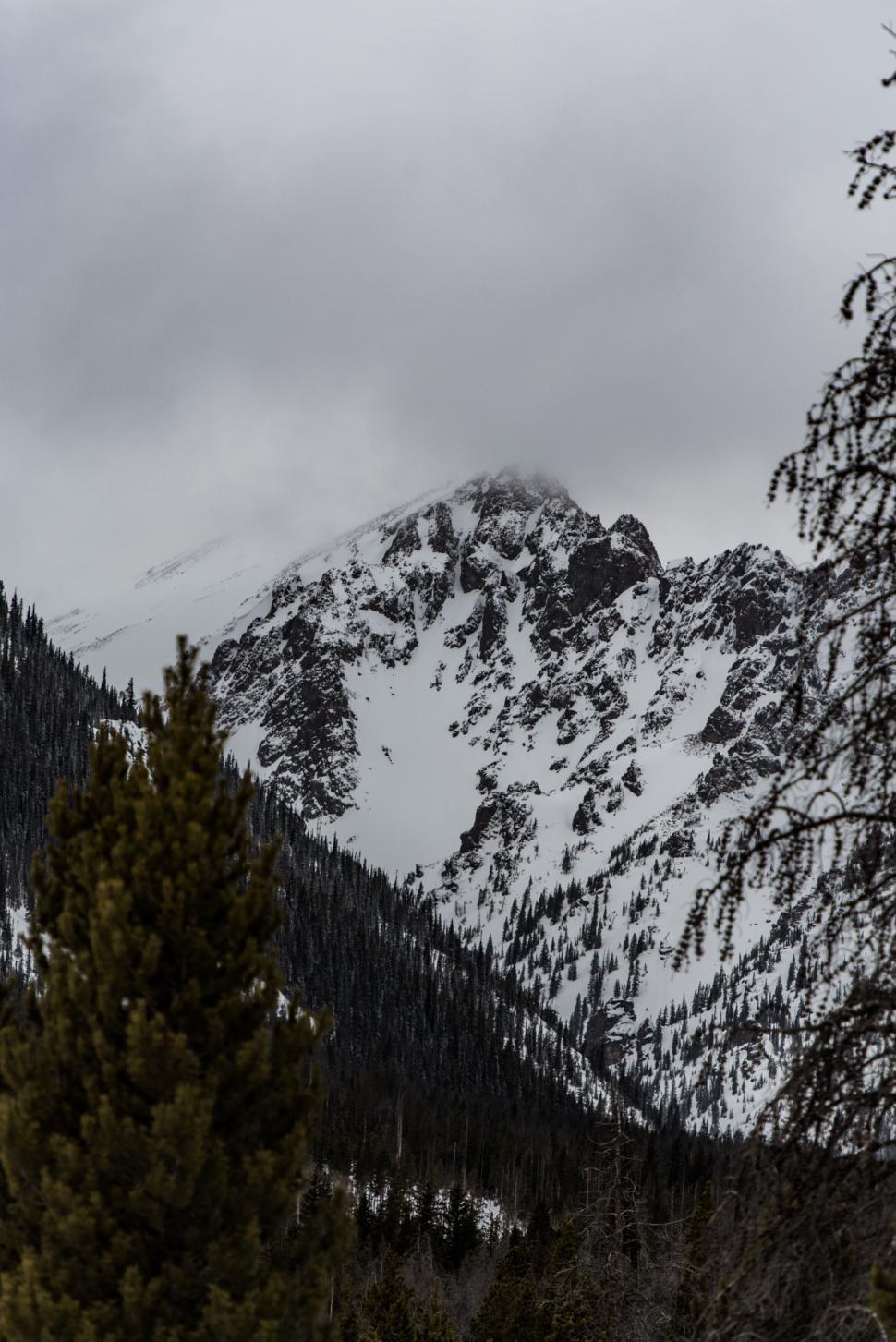 Free Stock Photo of Snowy peak of a rugged mountain hidden in clouds ...