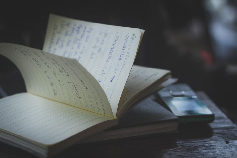 Free Stock Photo of Open notebook with handwritten notes on a table ...