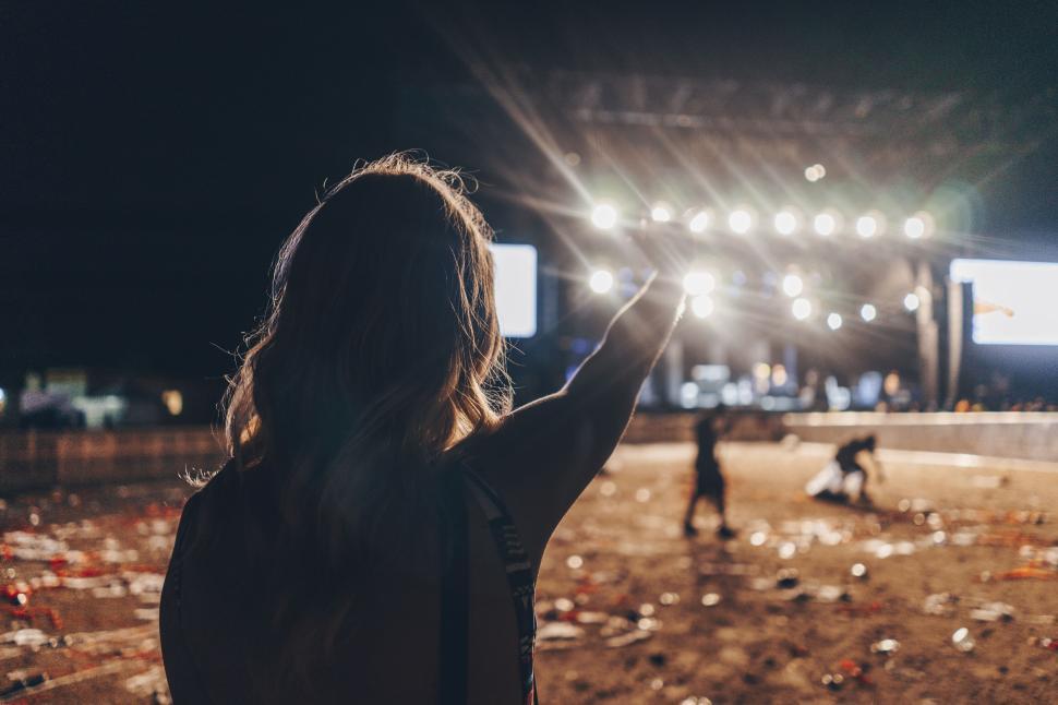 Free Stock Photo of Excited concert attendee pointing towards the stage ...