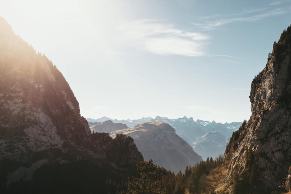 Free Stock Photo of Sunlit mountain landscape with distant mountain ...