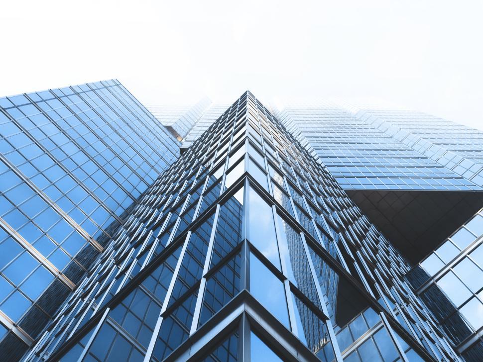 Free Stock Photo of High-rise glass building reaching towards cloudy ...