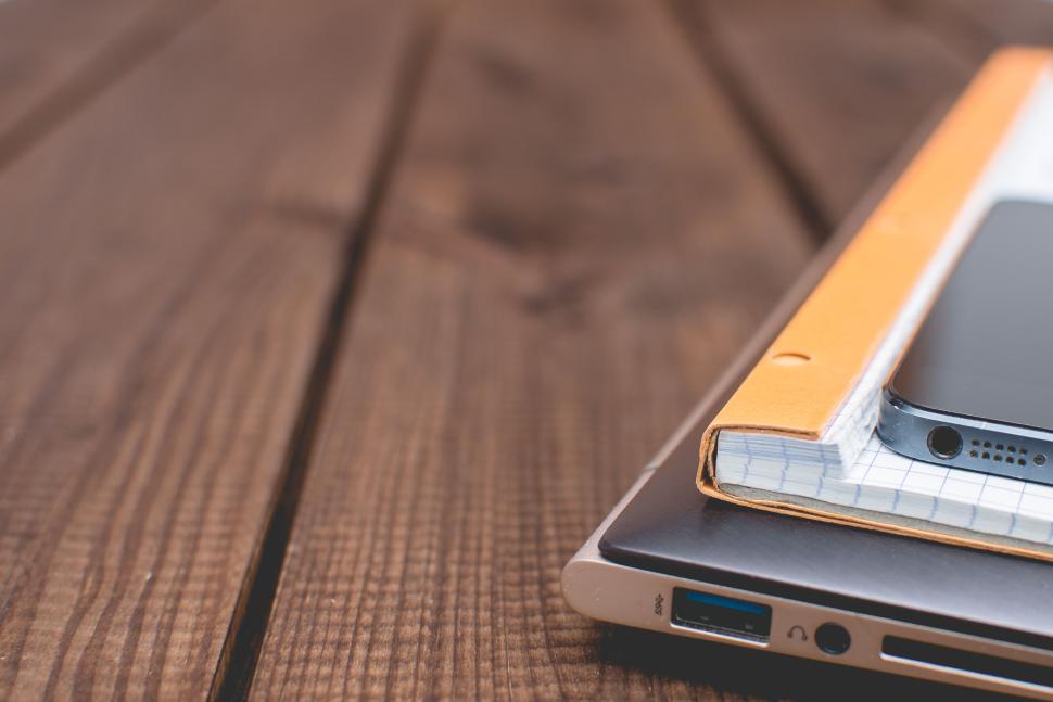 Free Stock Photo of Notebook and phone on wooden desk close-up view ...