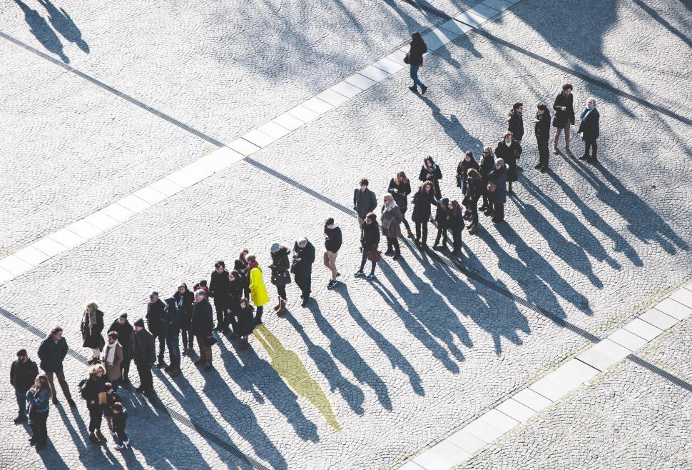Free Stock Photo of People in a line casting long shadows on pavement ...