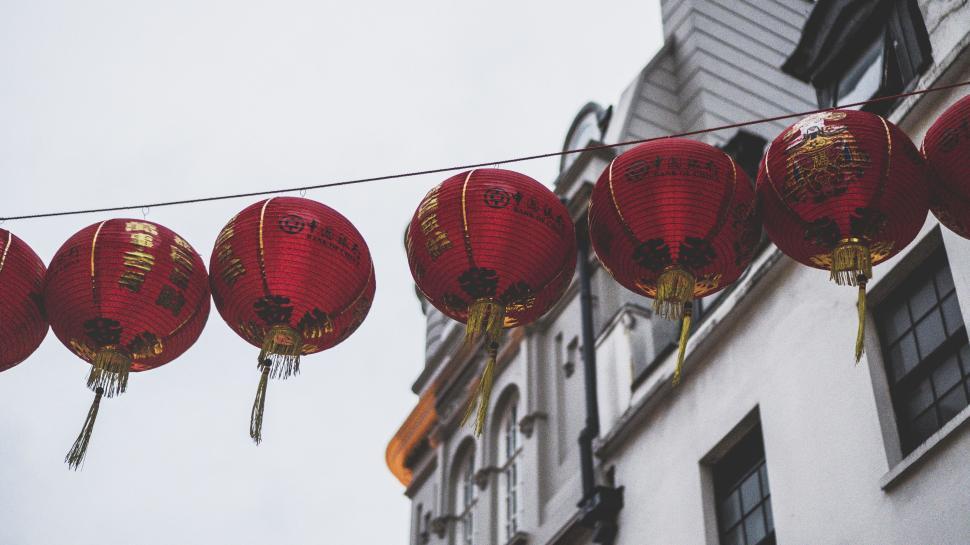 Free Stock Photo of Red lanterns string across traditional buildings at ...