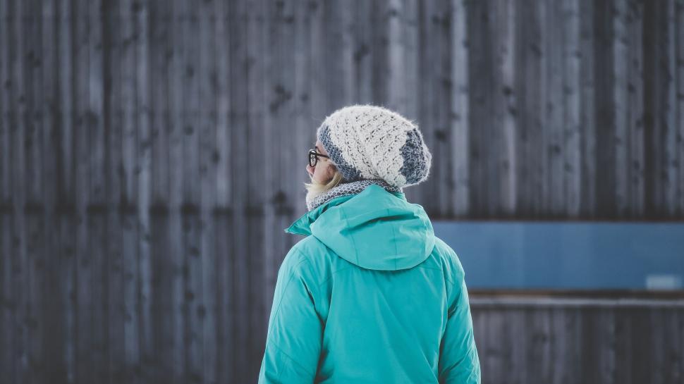 Free Stock Photo of Person in winter clothing facing wooden wall in ...