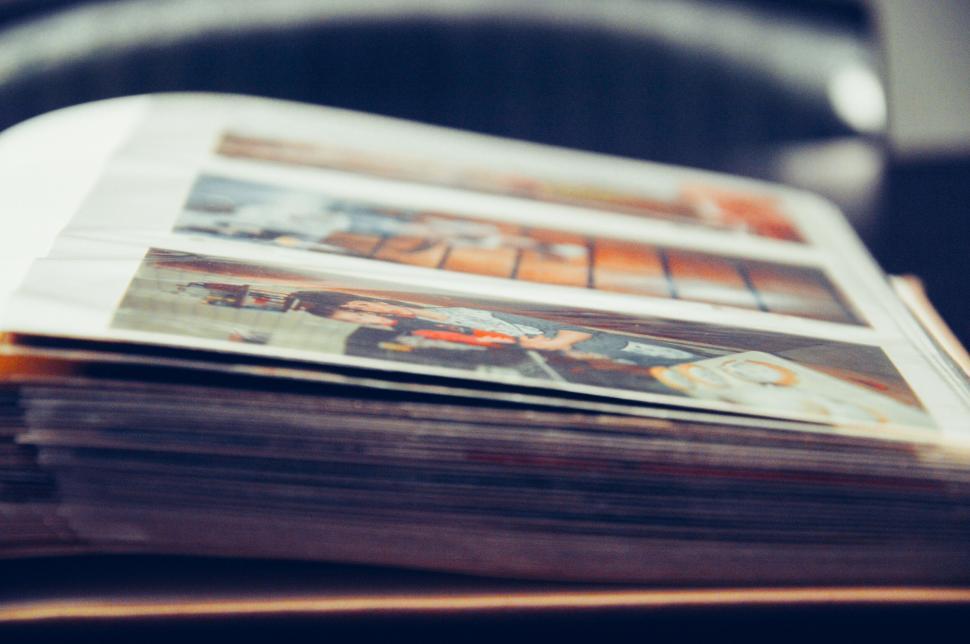 Free Stock Photo of Open photograph album on table showing multiple ...