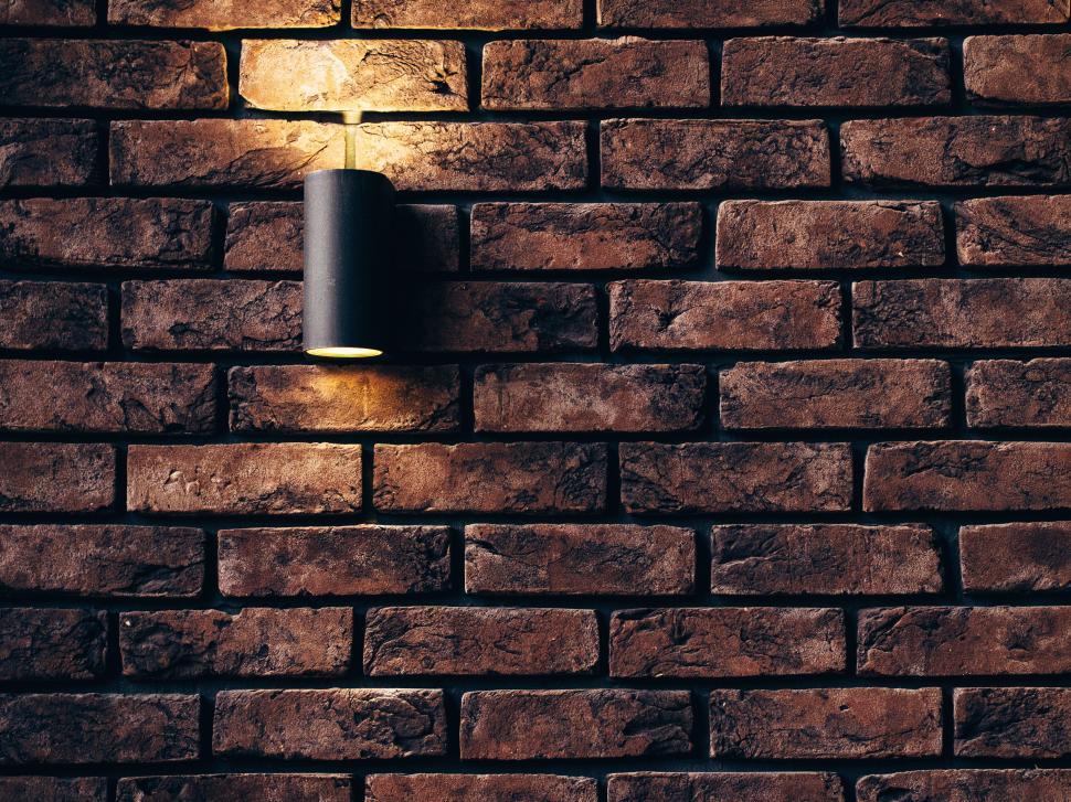 Free Stock Photo of Brick wall with light fixture casting a warm glow ...
