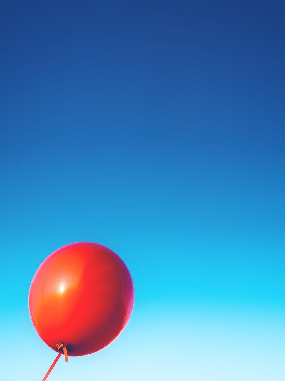 Free Stock Photo of Single red balloon floating against clear blue sky ...