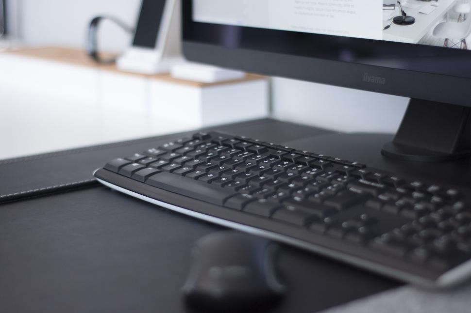 Free Stock Photo of A neat desk setup featuring a keyboard and mouse ...