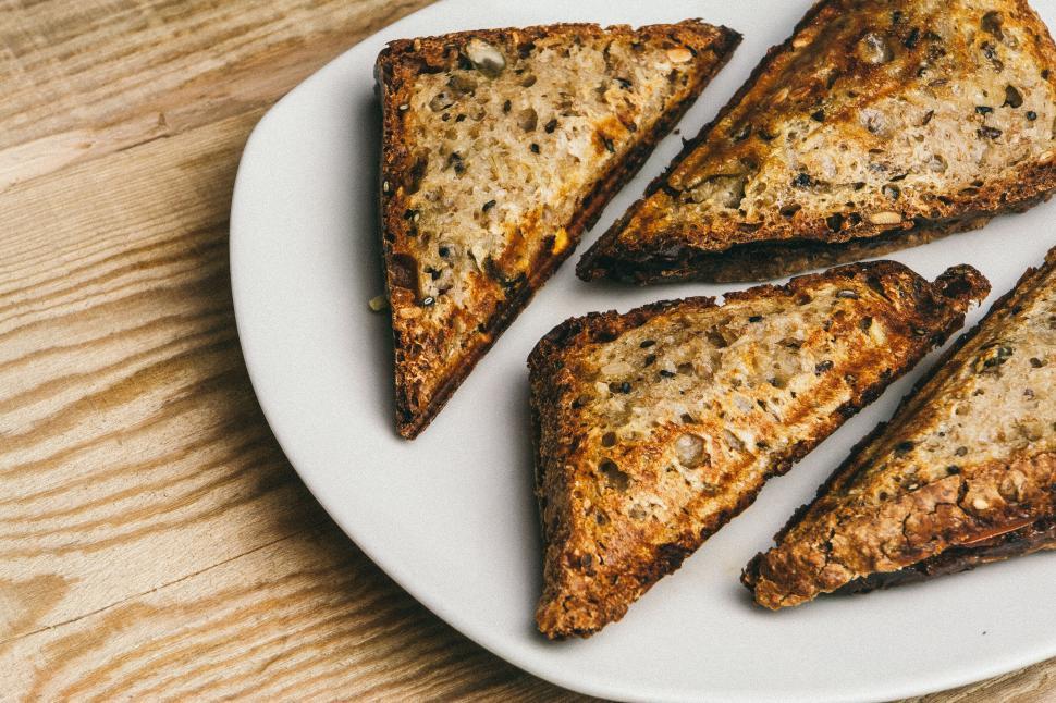Free Stock Photo of Toasted triangles of bread with seeds on white ...