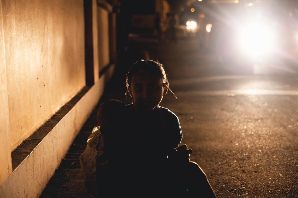 Free Stock Photo of Silhouette of a person sitting against streetlight ...