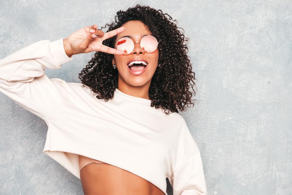 Free Stock Photo of Woman in crop top and sunglasses, playful peace ...