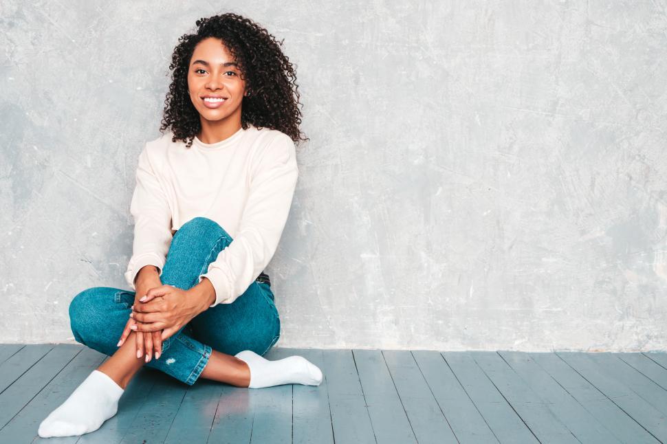 Free Stock Photo of Smiling woman sitting cross-legged on floor indoors ...