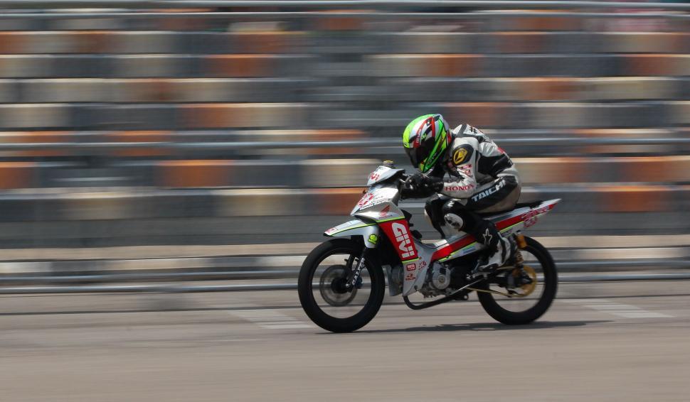 Free Stock Photo of Speeding motorcycle racer on track showcasing ...
