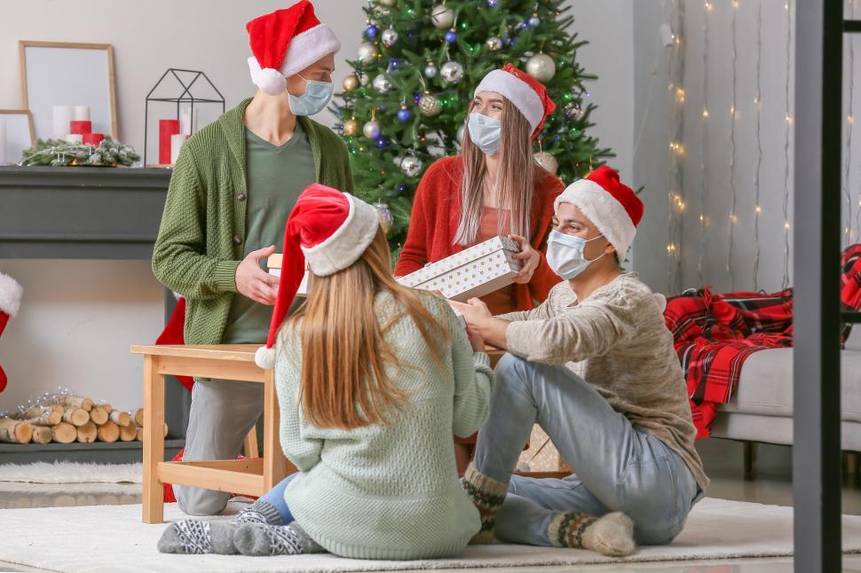 Free Stock Photo of Friends Opening Christmas Gifts and Celebrating ...