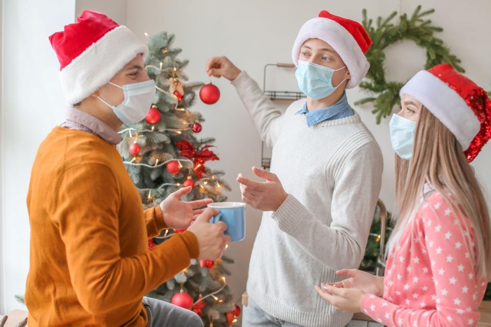 Free Stock Photo of Friends decorating Christmas tree and sharing ...