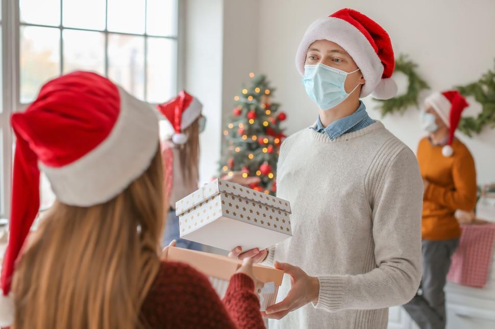 Free Stock Photo of People sharing Christmas gifts in a bright room ...