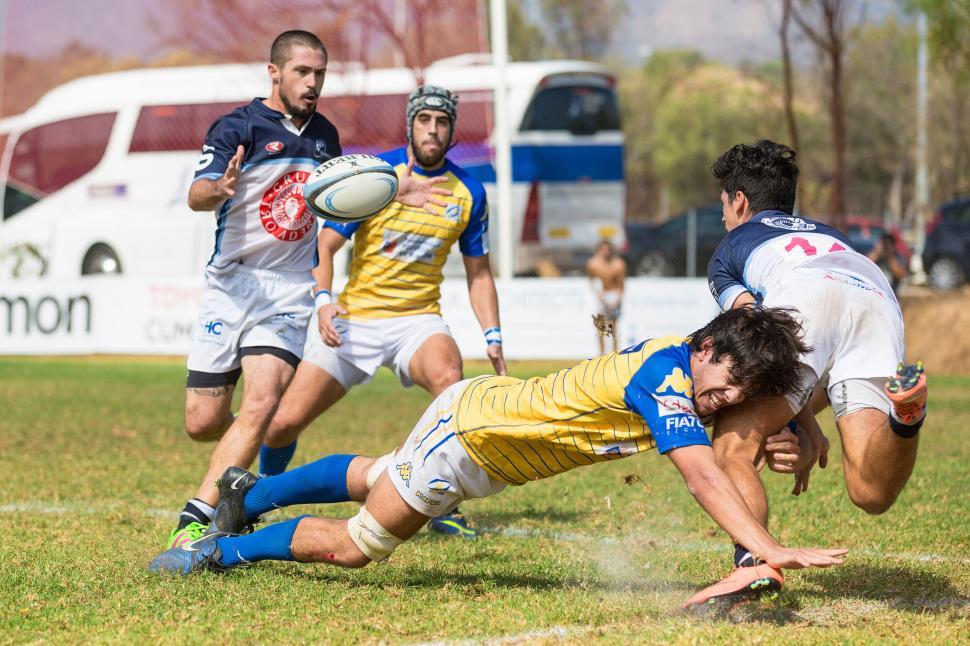 Free Stock Photo of Rugby player diving forward during competitive game ...
