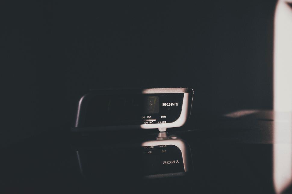 Free Stock Photo of Sony digital alarm clock spotlighted in dark room ...