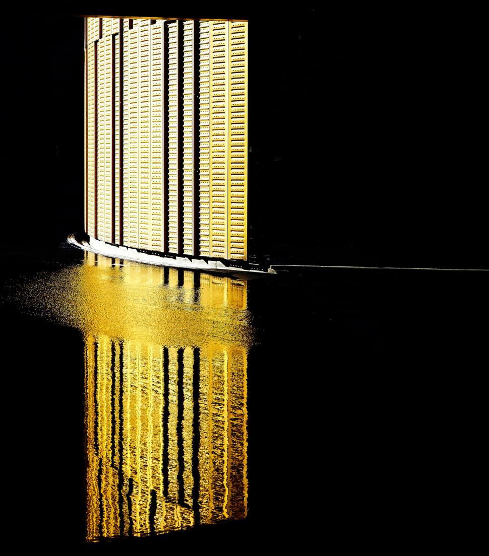 Free Stock Photo of Golden vertical bars casting reflection on dark ...