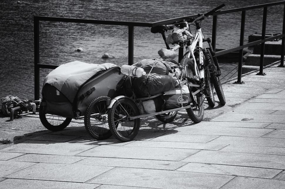 Free Stock Photo of Loaded bicycle with trailer by a lakeside pavement ...