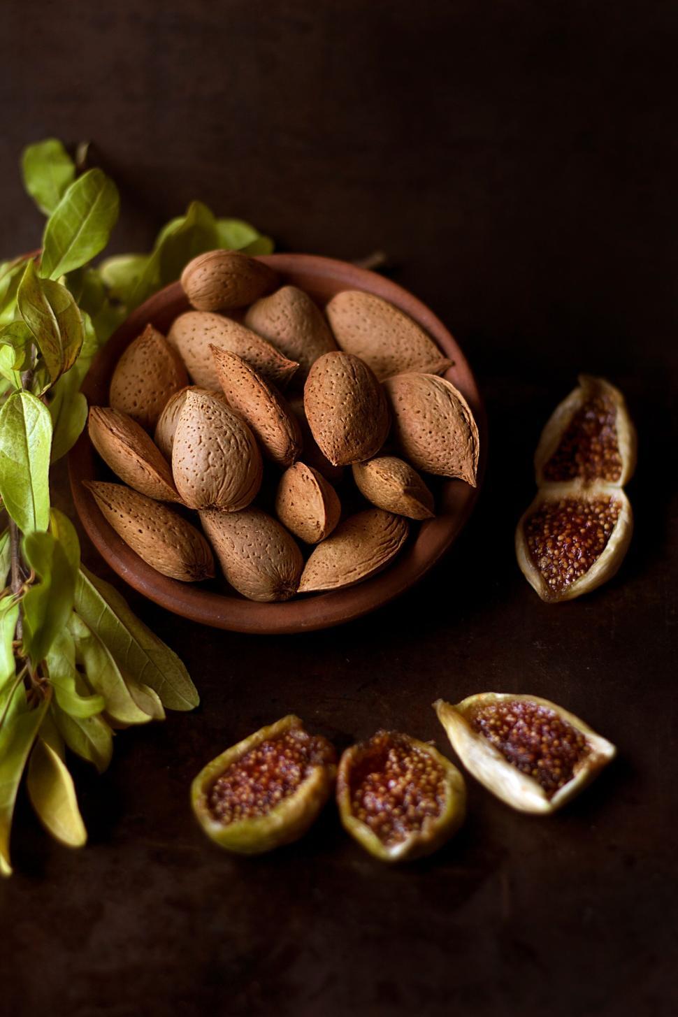 Free Stock Photo of Dish of almonds and figs with green leaves on ...