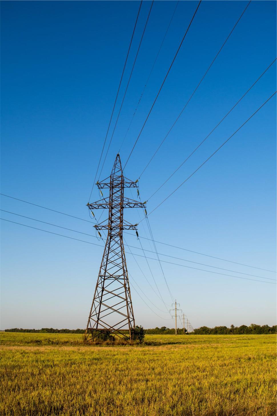 Free Stock Photo of Tall metal electricity pylon in vast green field ...