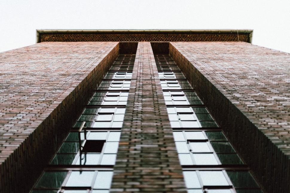 Free Stock Photo of Upward view of a tall brick building with windows ...