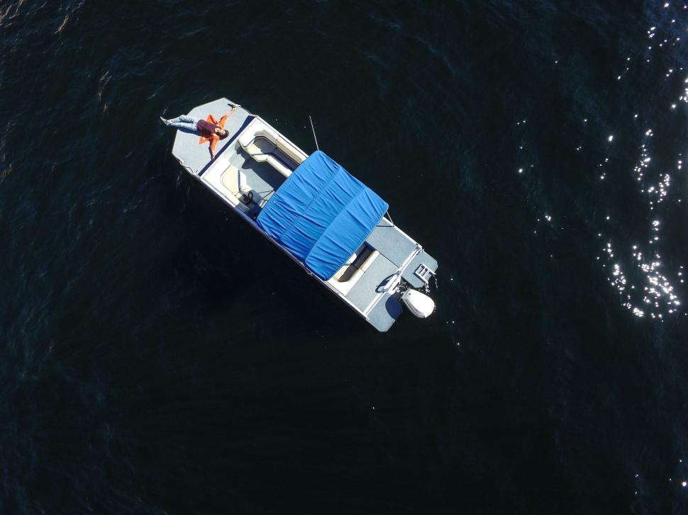 Free Stock Photo of Aerial view of a blue-topped boat afloat on the ...