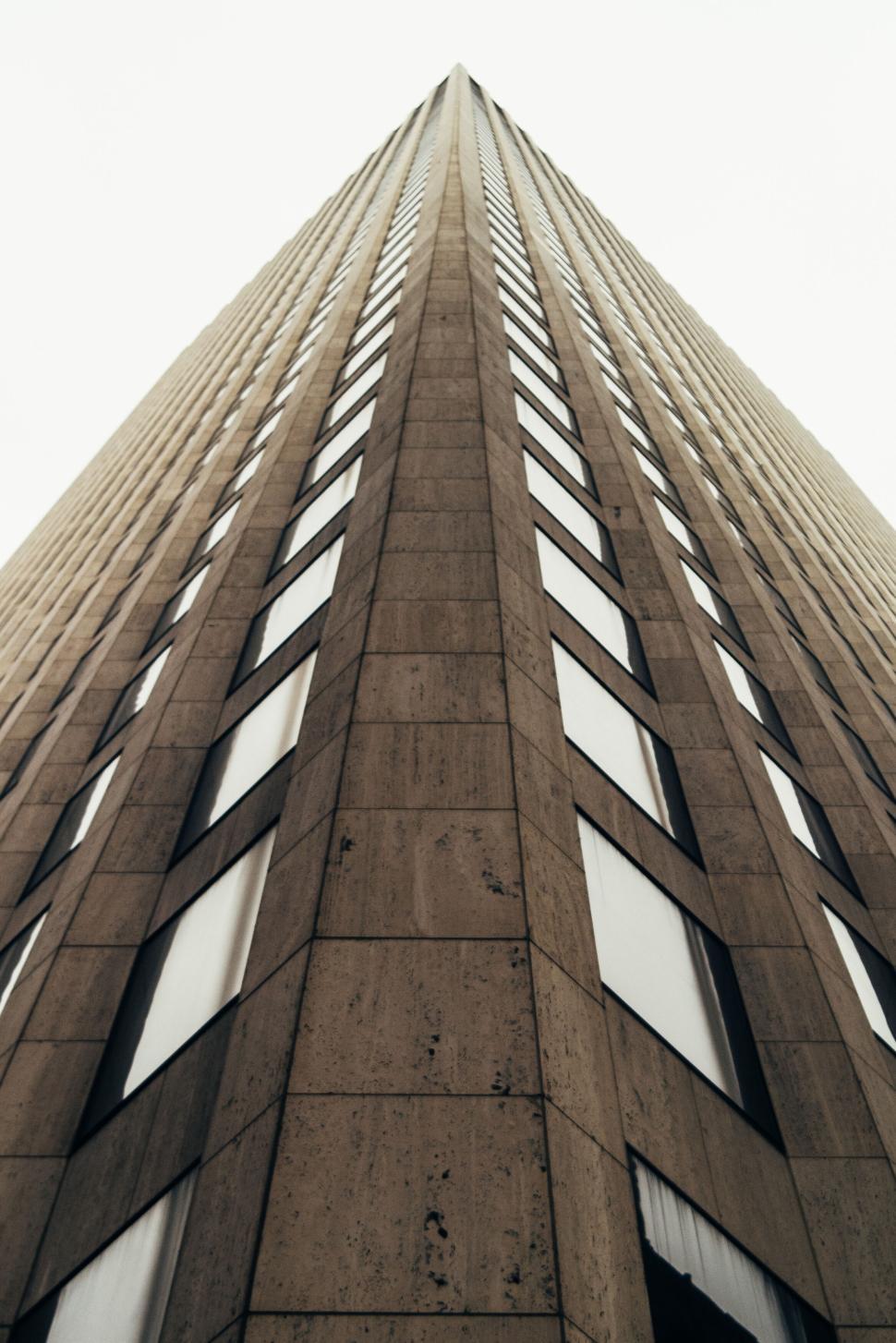 Free Stock Photo of Low angle view of a tall skyscraper reaching ...