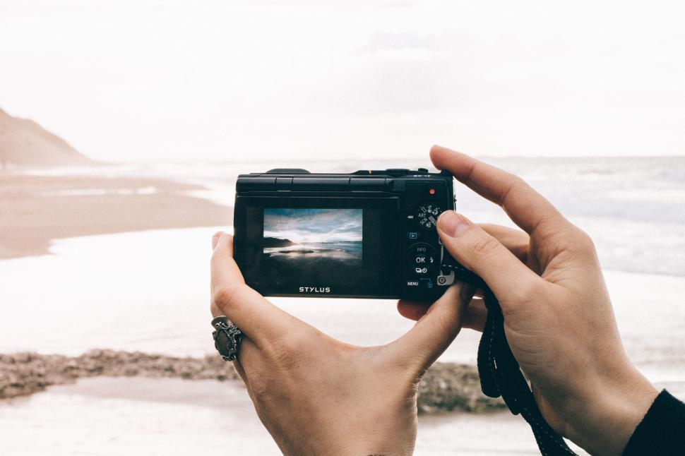 Free Stock Photo of Person capturing serene beach view with camera ...