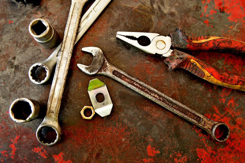 Free Stock Photo of Rusty tools on red surface including pliers and ...