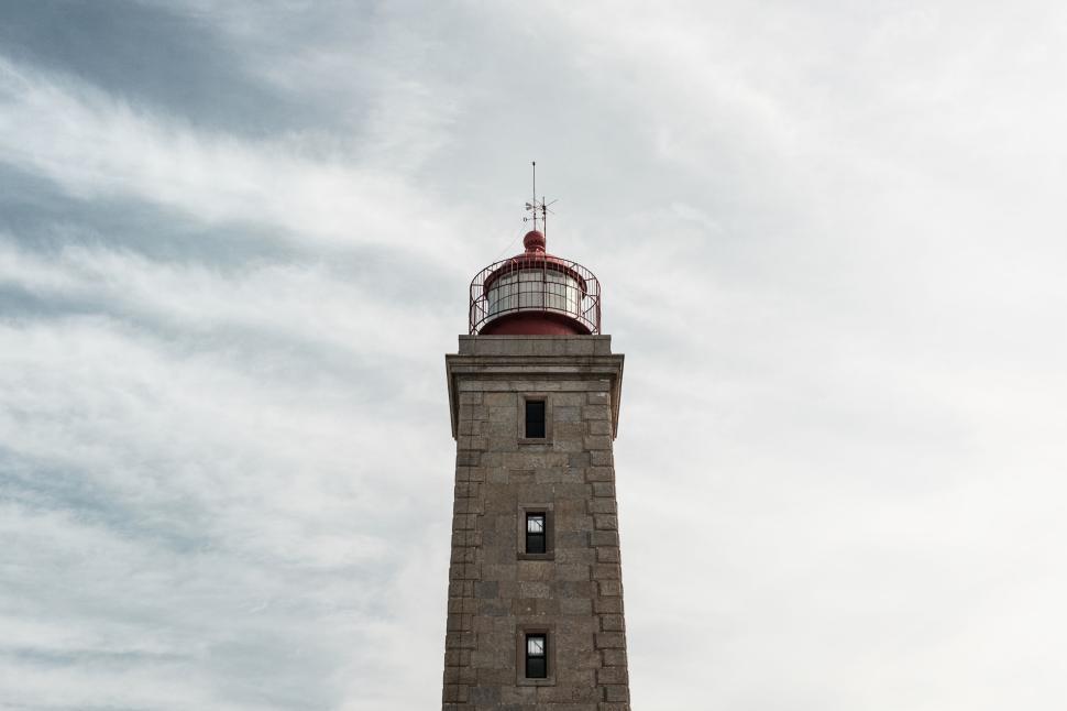 Free Stock Photo of Historic lighthouse standing tall against a cloudy ...