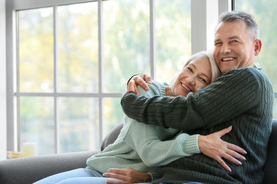 Free Stock Photo of Elderly couple hugging on a couch indoors brightly ...