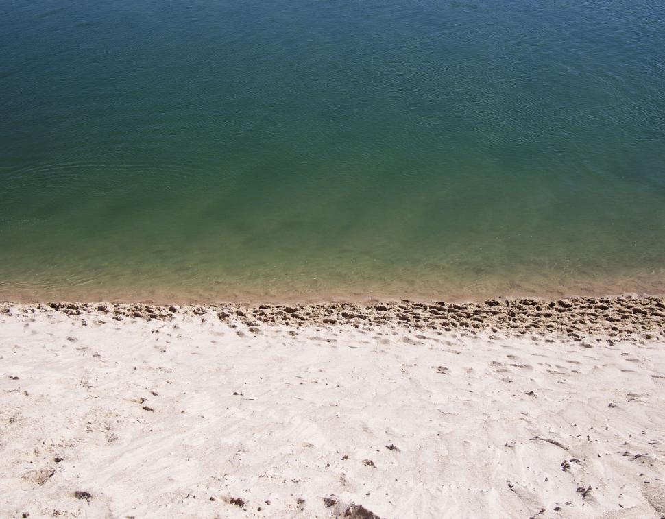 Free Stock Photo of Calm shoreline with clear water meeting sandy beach ...