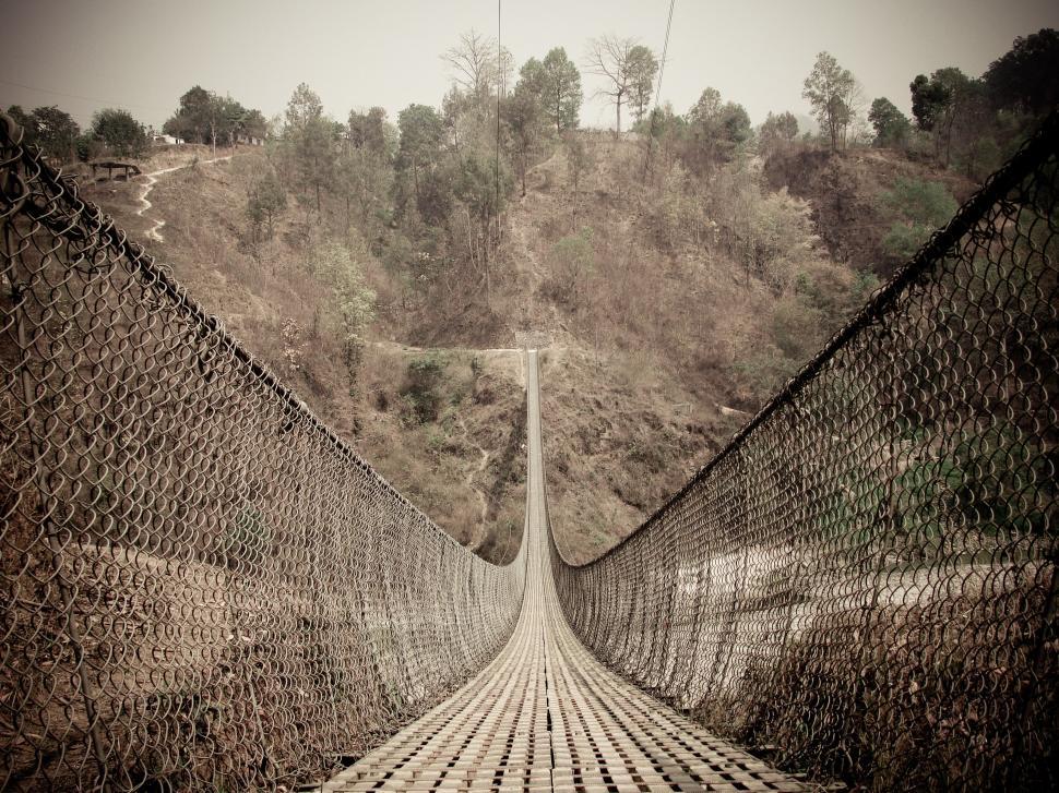 Free Stock Photo of Suspension bridge spanning over rugged landscape ...
