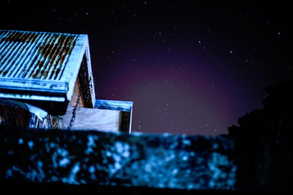 Free Stock Photo of Starry night over a rustic building with colorful ...