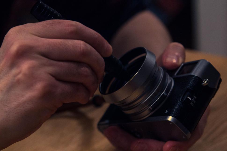 Free Stock Photo of Person cleaning camera lens with a small brush tool ...