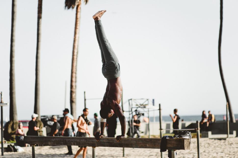 Free Stock Photo of Person doing a handstand on a bar at the beach ...
