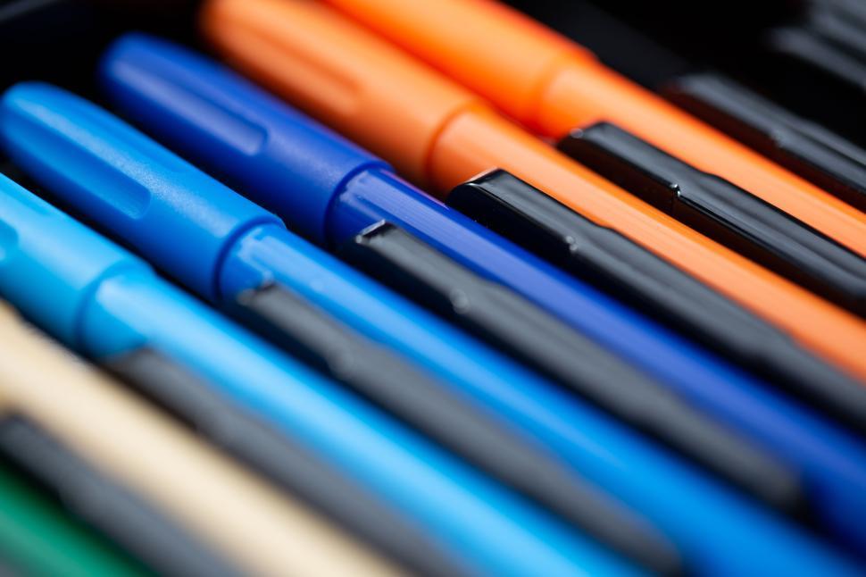 Free Stock Photo of Colorful pens arranged in a neat row, close-up view ...