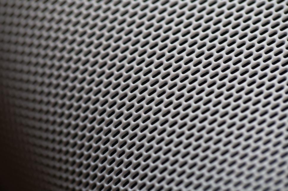Free Stock Photo of Close-up of perforated surface with teardrop-shaped ...