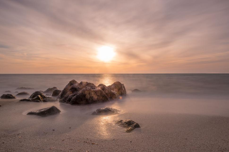 Free Stock Photo of Calm ocean sunset with rocks and smooth water ...